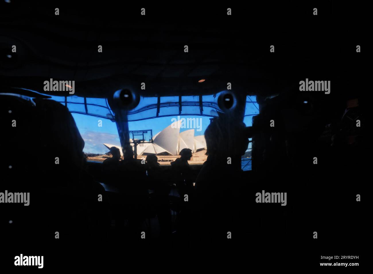 The Sydney Opera House reflected in a distorted Fun House Mirror Image ...