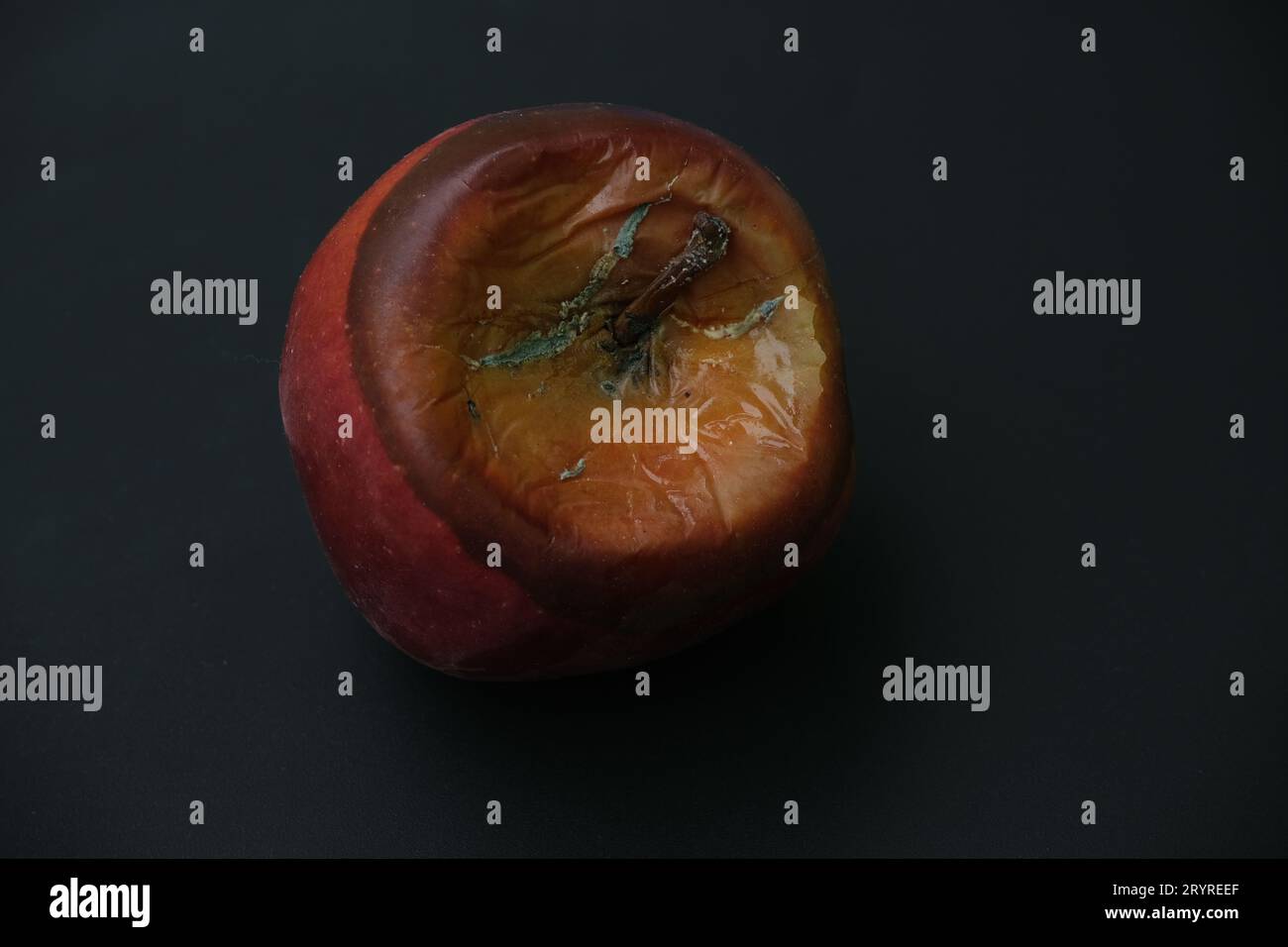 Apple Rotten on black background Stock Photo - Alamy
