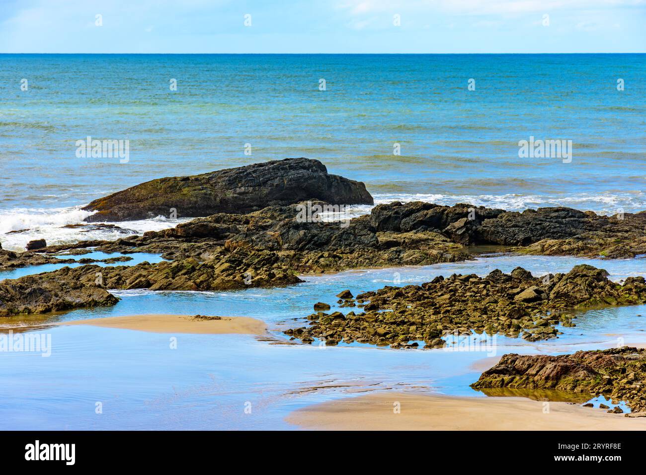 Sand between the rocks and the sea at Prainha beach Stock Photo - Alamy