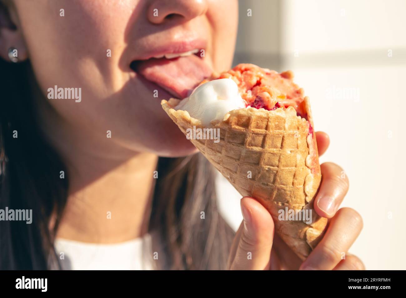 Close-up female lips eating a ice cream cone Stock Photo - Alamy