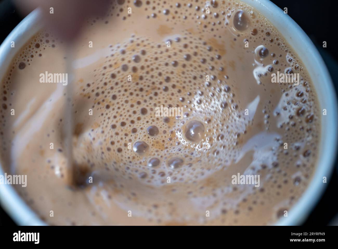 Macro Photo of Stirring Pakistani Chai Stock Photo - Alamy