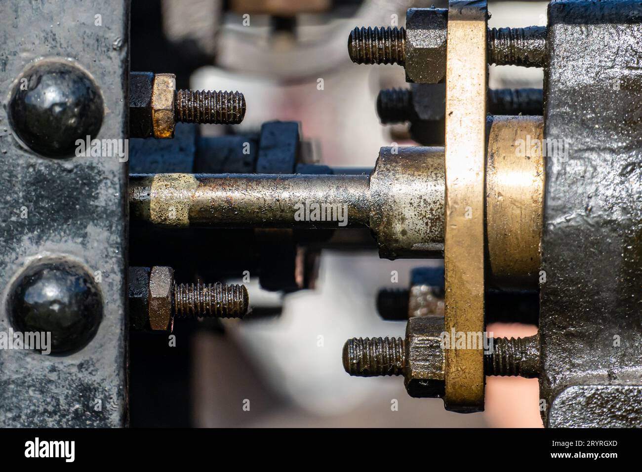 A close-up of a steampunk piston of a steam engine, with intricate and ...