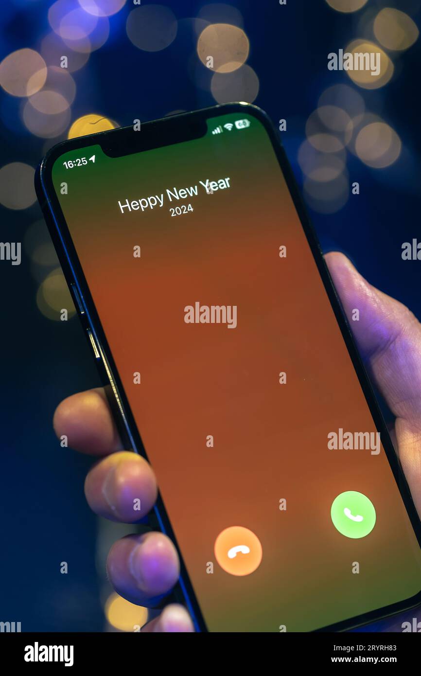Incoming call screen from Happy New Year, close up Stock Photo - Alamy