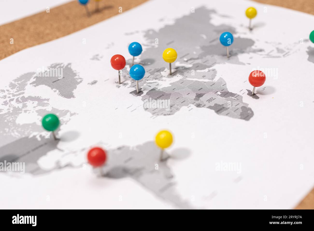 Close up of Pushpins on world map on Corkboard. Travel destination ...