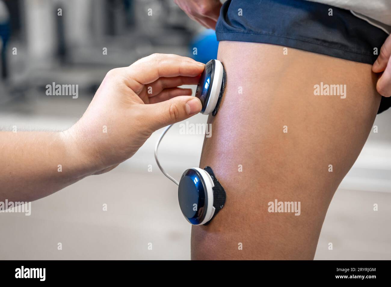 The procedure of myostimulation on the legs of a woman Stock Photo - Alamy