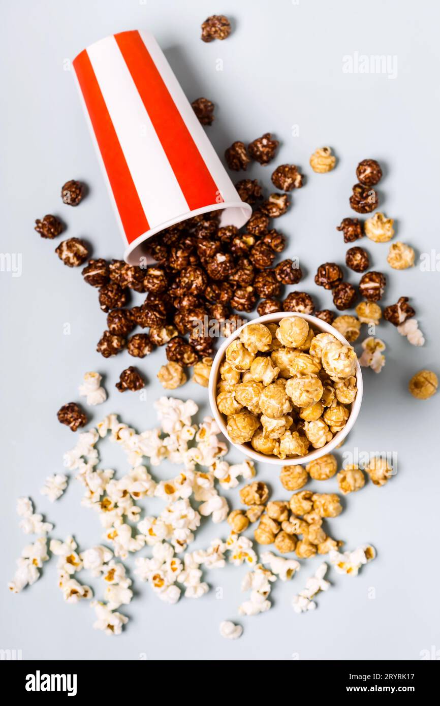 Assorted popcorn set in paper striped white red cup. Sweet and salty ...