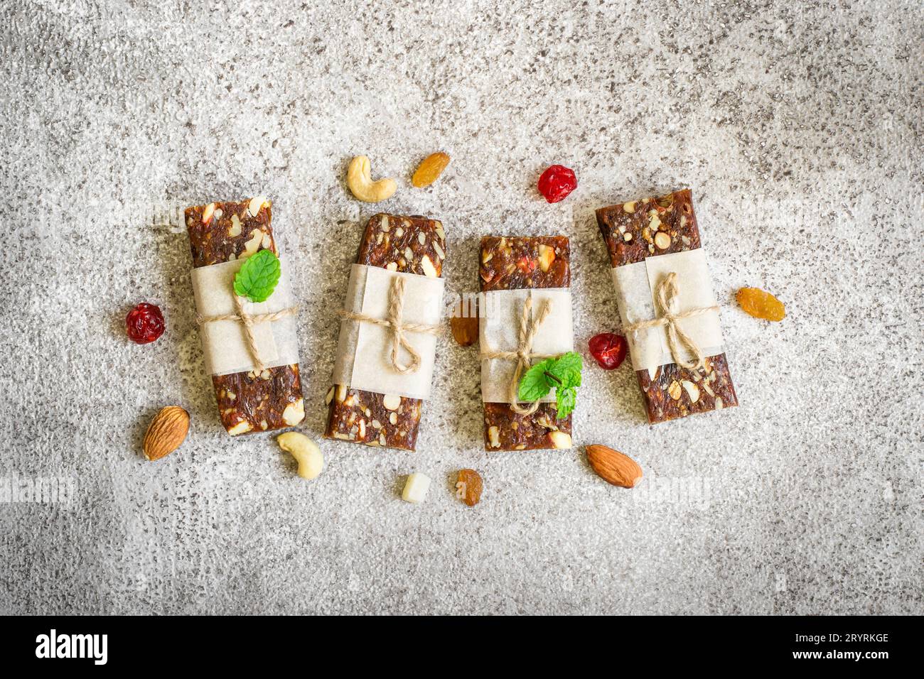 Healthy snack bars of dried fruits and nuts on gray background Stock ...
