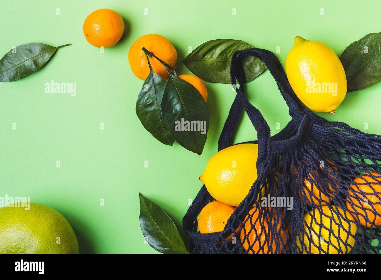 Set of citrus in mesh textile bag. Healthy food and zero waste concept ...