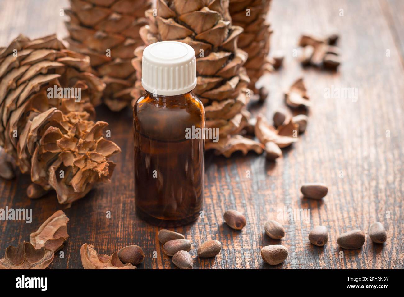 Essential Cedar Oil in a small bottle, selective focus Stock Photo - Alamy