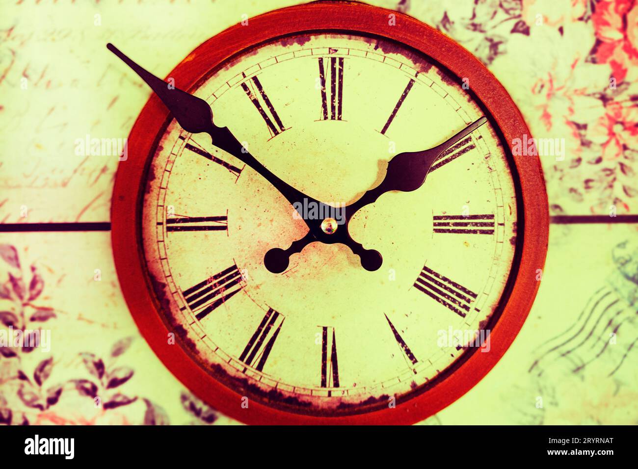Old vintage clock on a wooden background. Round dial of the wall clock ...