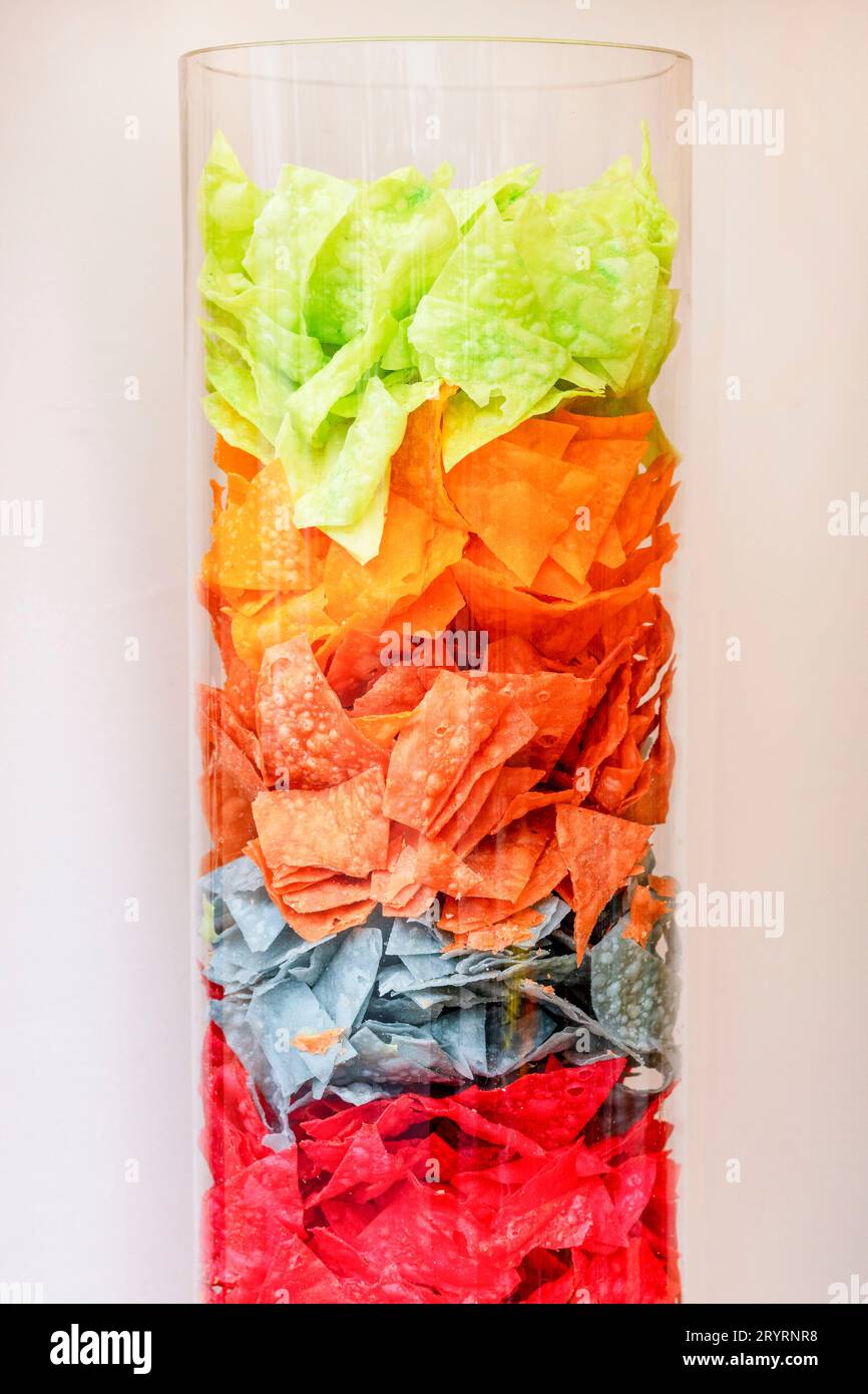 colored chips in a tube, chips in a glass container. Multi-colored ...