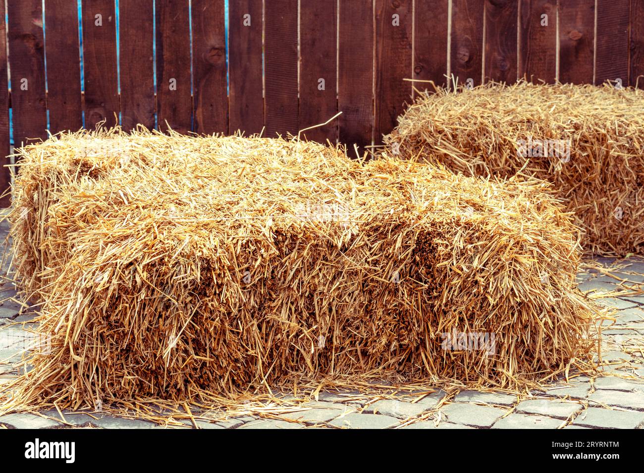 Stacks of straw. Alternative fuel source. Concept Alternative fuel ...