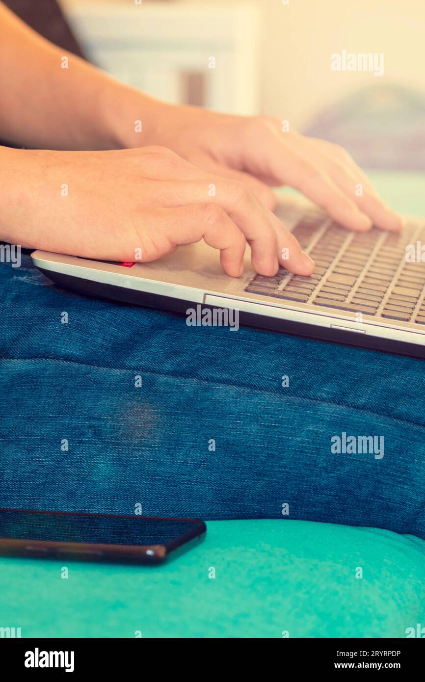 close-up. man with laptop.Guy with computer, Smartphone. side view ...