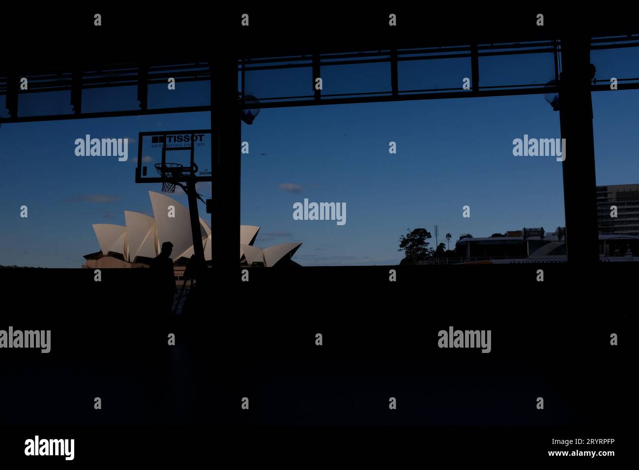 Sydney opera house seen framed by the interior silhouette of the ...