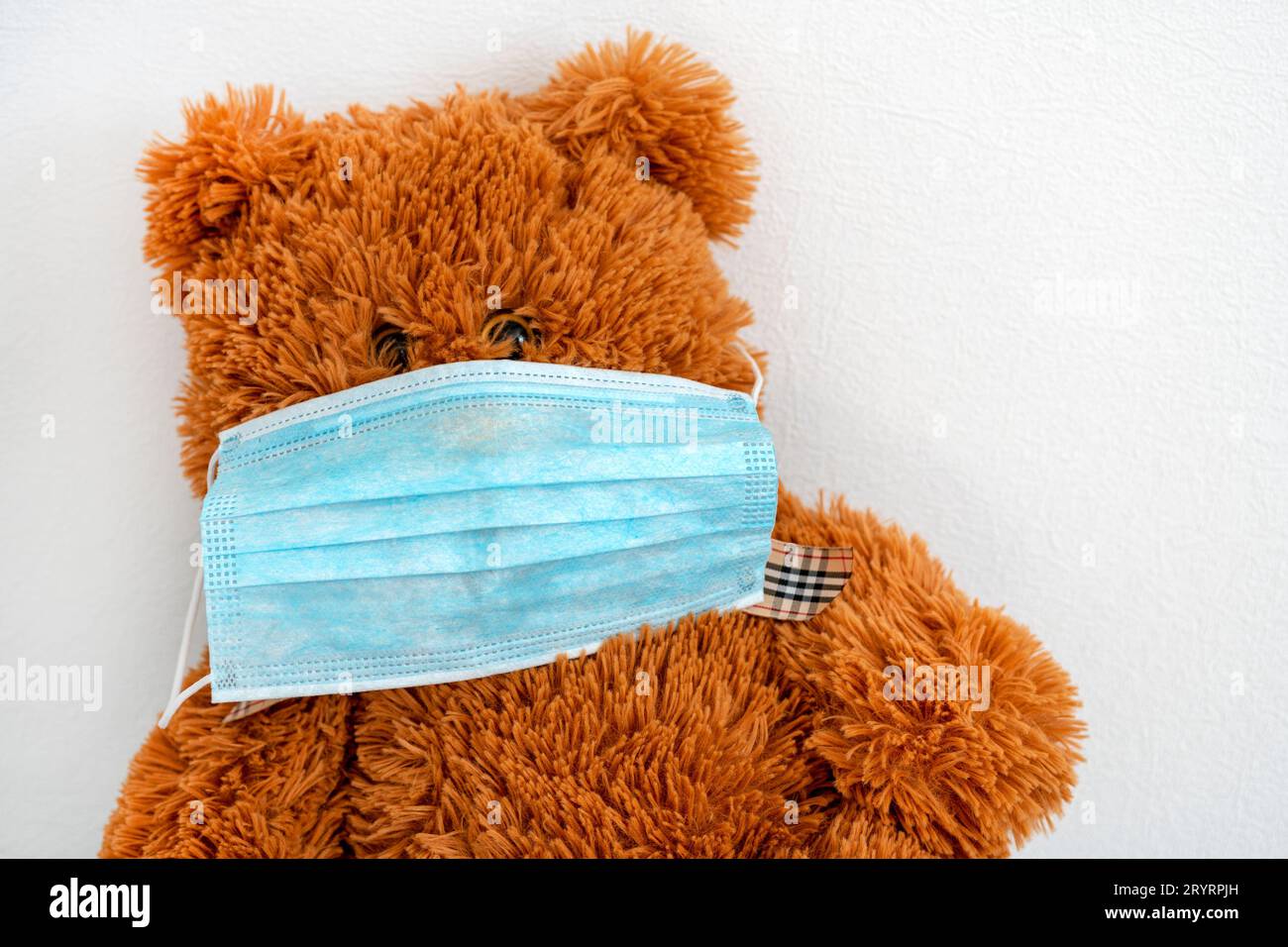 Teddy bear with protective mask. The concept of care for loved ones in ...