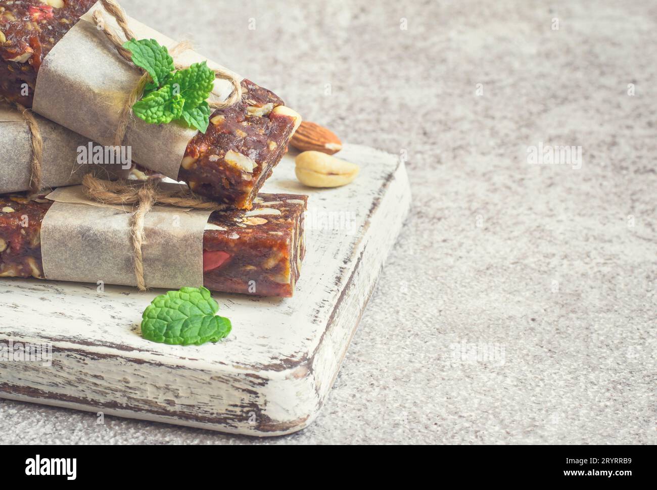 Healthy snack bars of dried fruits and nuts on gray background Stock ...