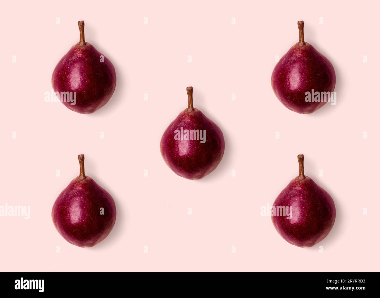 Pink purple pears on pink background. Minimalist style. Autumn harvest ...