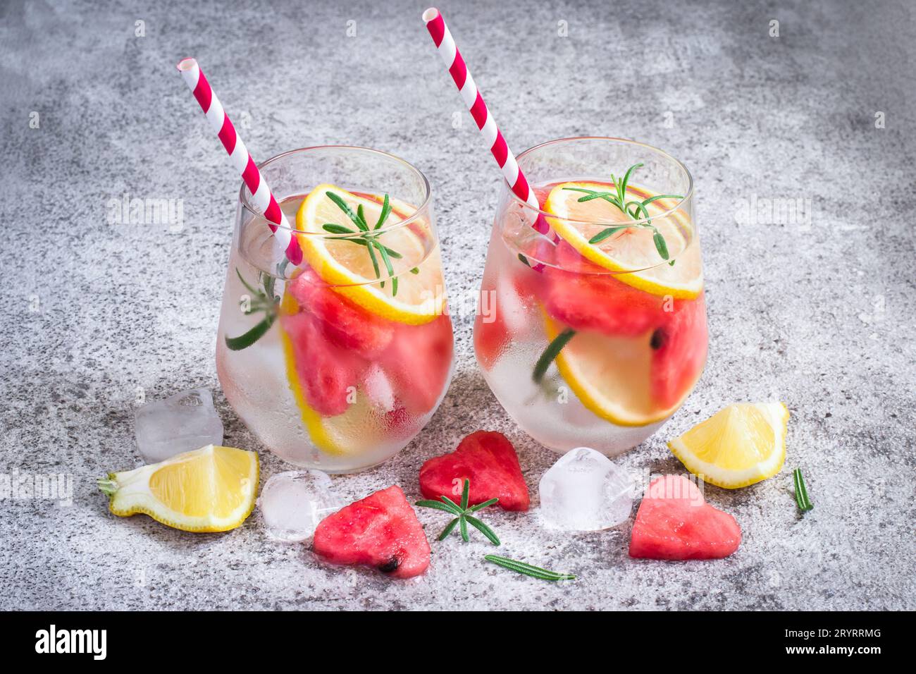 Watermelon lemon lemonade with pieces of watermelon in shape of heart. Refreshing summer drink ...