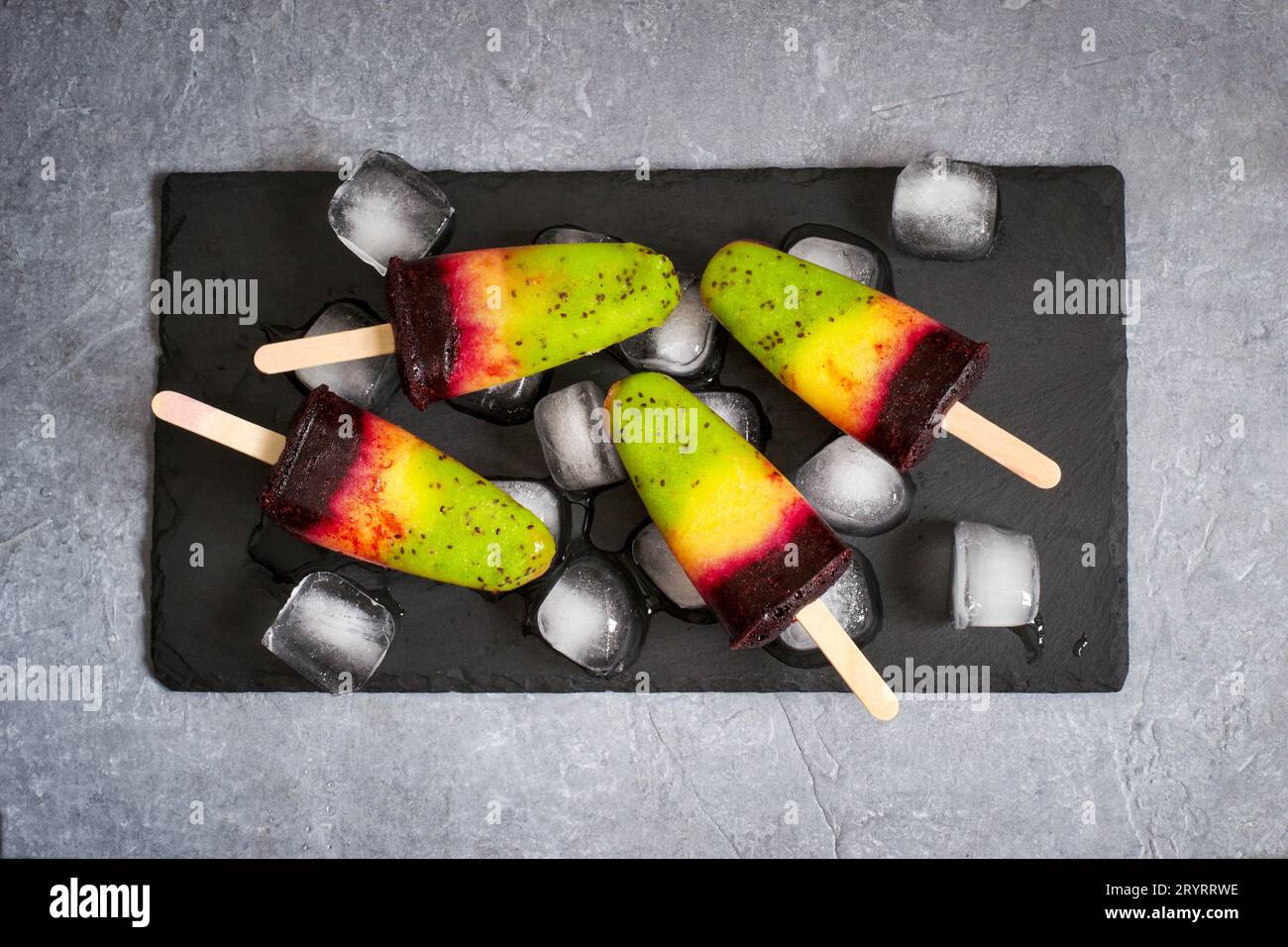 Colorful layer ice cream on a stick made from natural fruit. Top Stock ...