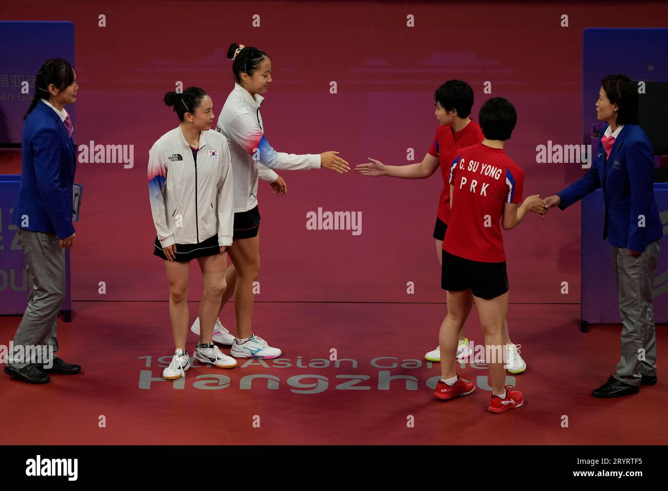 From left, South Korea's Jeon Jihee and Shin Yubin shake hands with ...