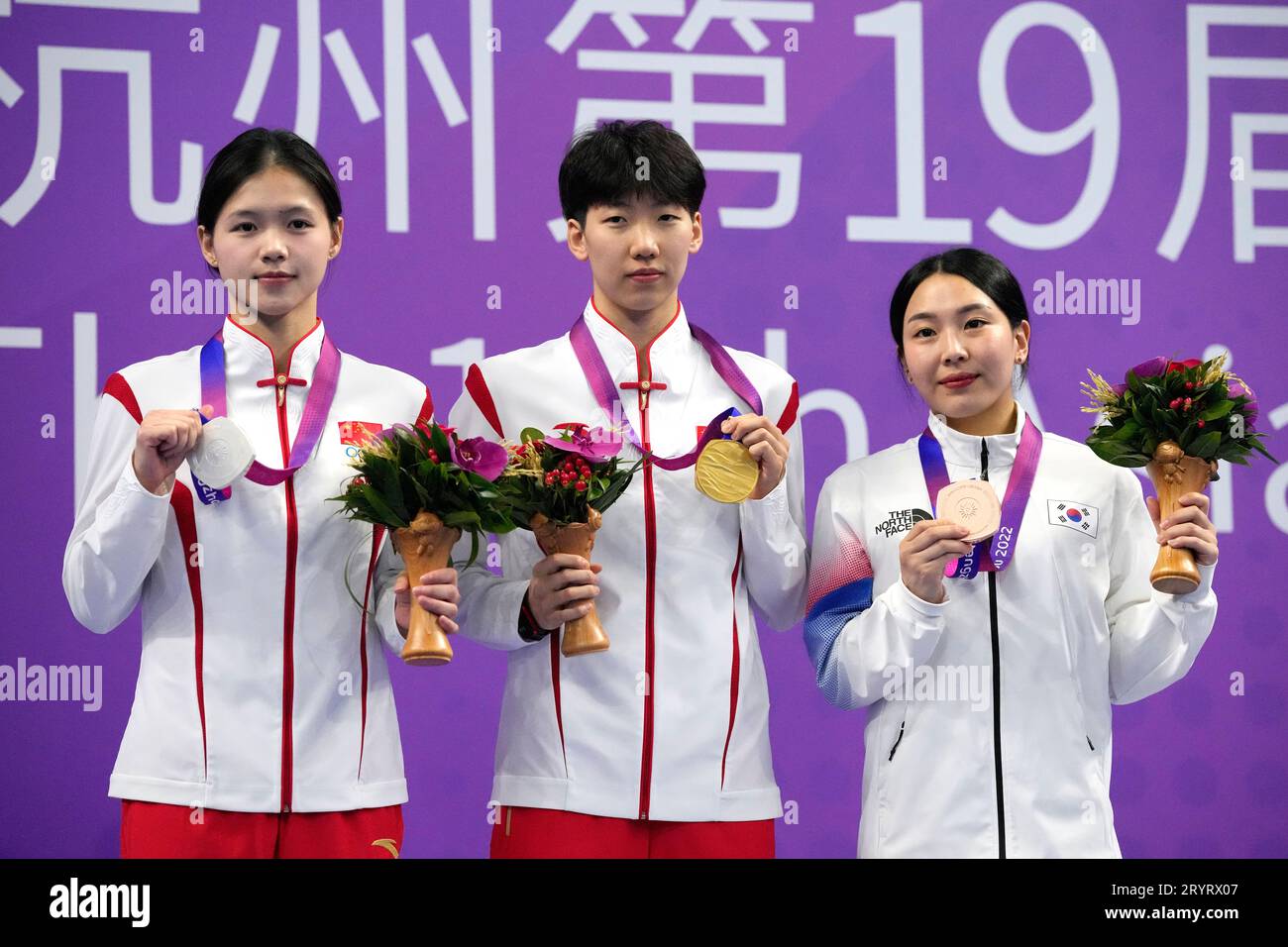 From left, silver medalist Lin Shan of China, gold medalist Li Yajie of ...