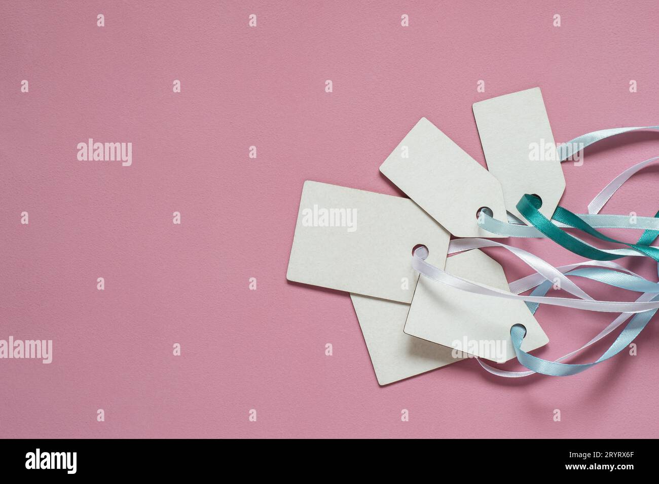 Blank paper price sale tags On pink background Stock Photo - Alamy