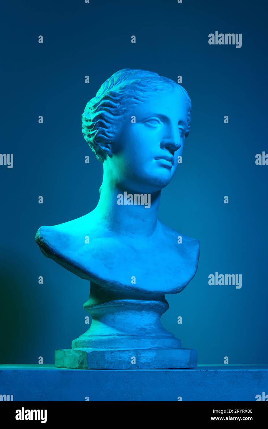 Plaster copy of Venus statue. Gypsum antique statue bust against blue ...