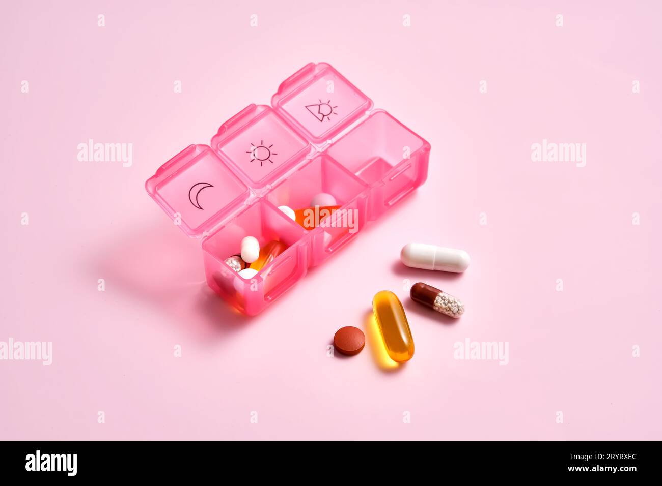 Bright pill box with different pills and vitamins Stock Photo - Alamy