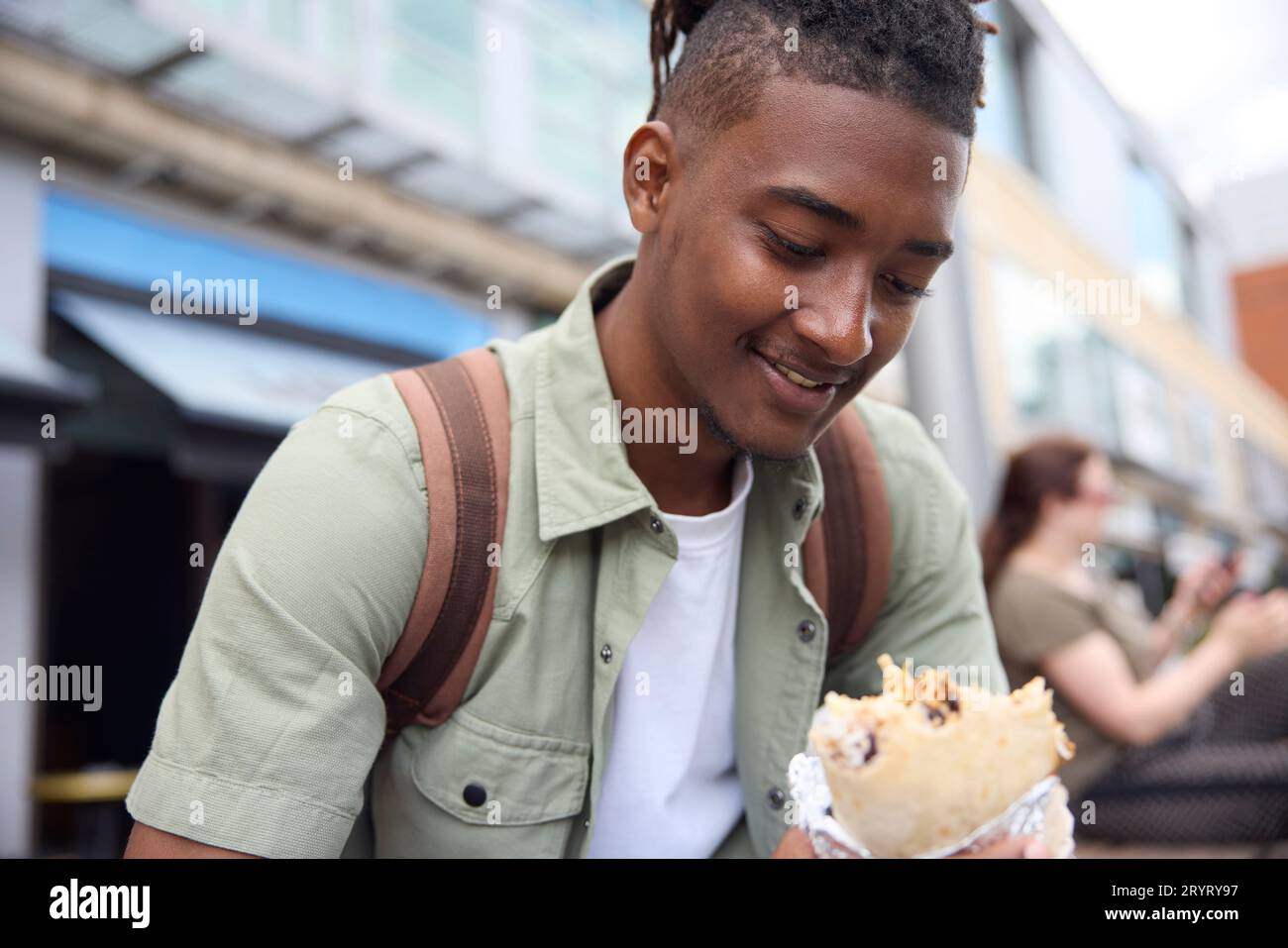 Mexican eating burrito hi-res stock photography and images - Alamy