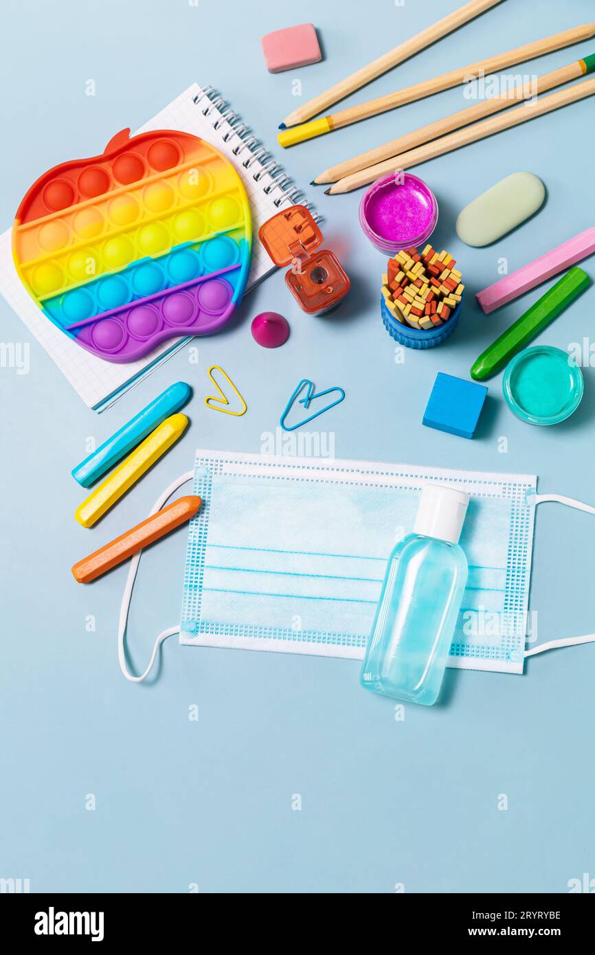 School supplies, poppit anti-stress, face mask, bottle of sanitizer ...