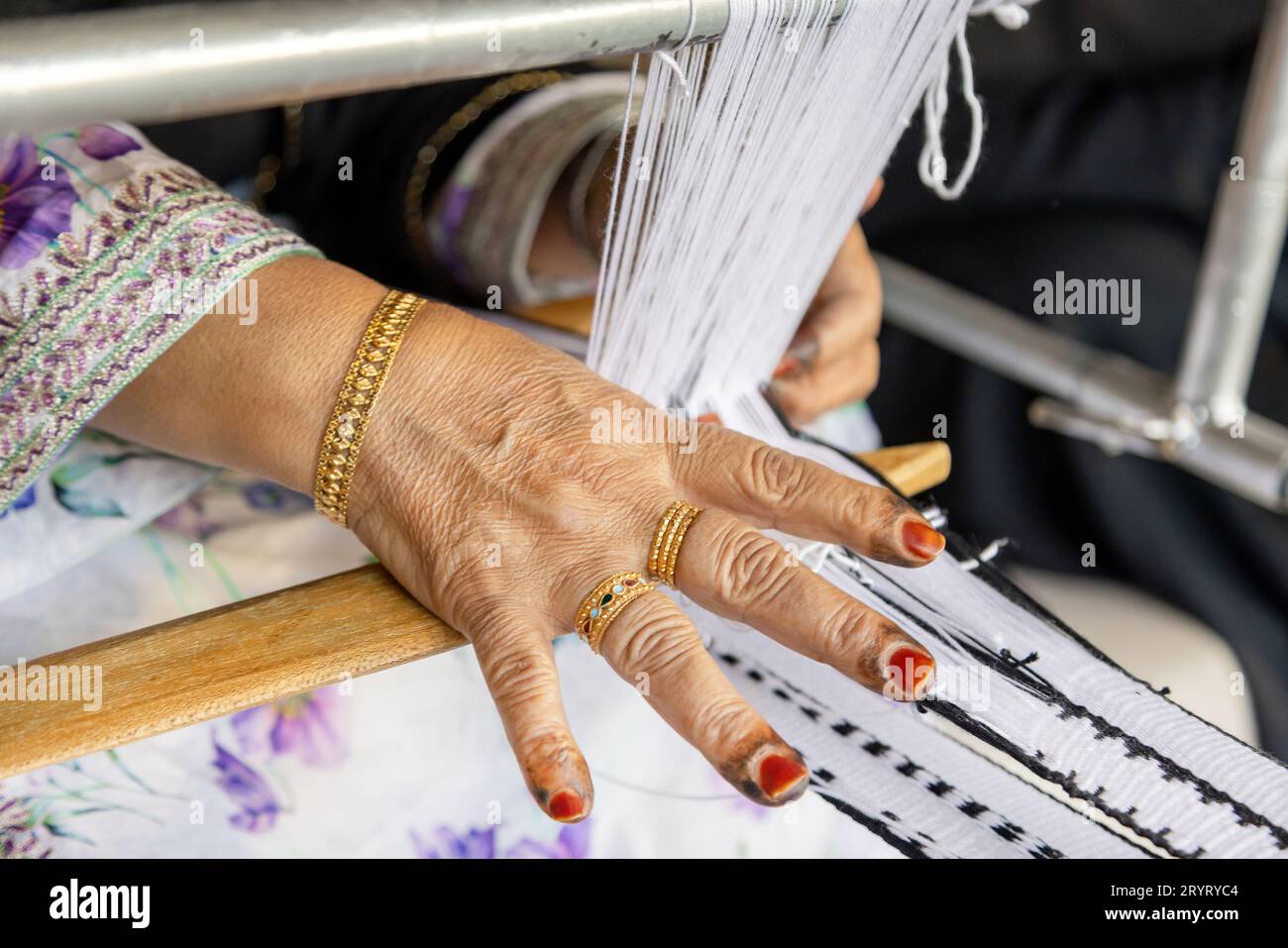 Female hands using weaving machine hi-res stock photography and images ...