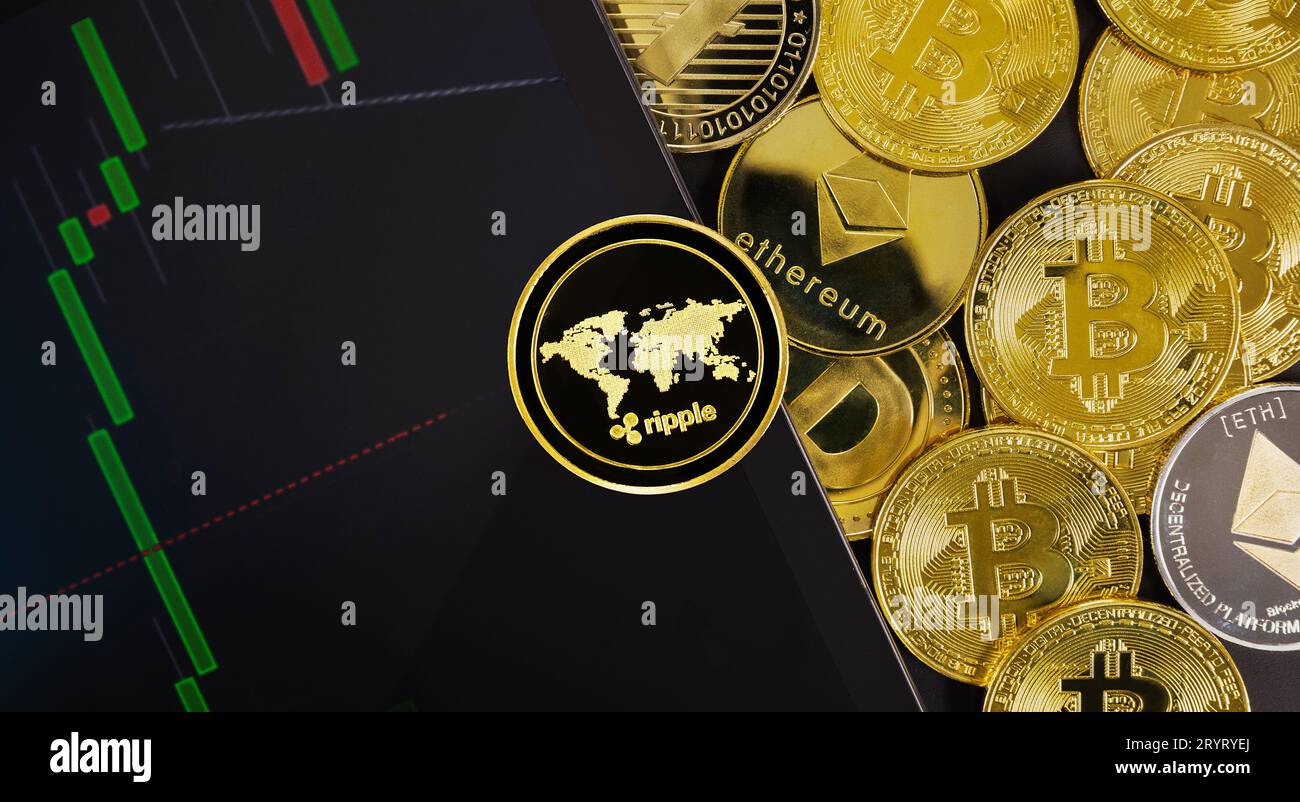 Wide image of Ripple on digital tablet with graph by various coins ...