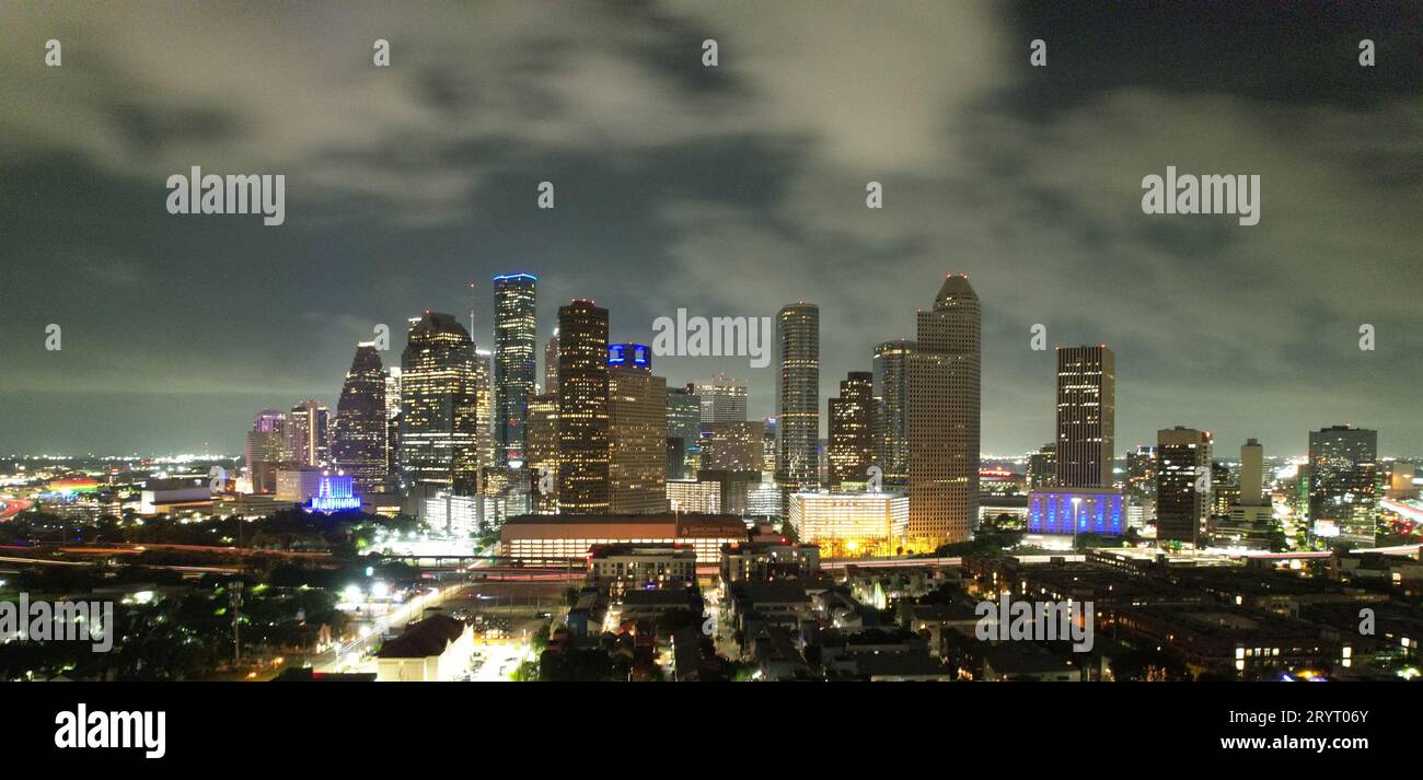An aerial view of the vibrant Houston skyline at night with illuminated ...