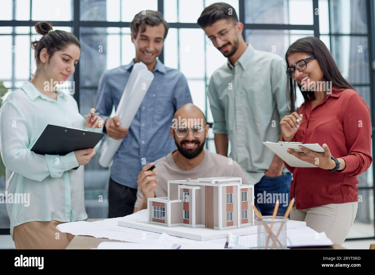 Architects and designers working on house layout in office studio Stock ...