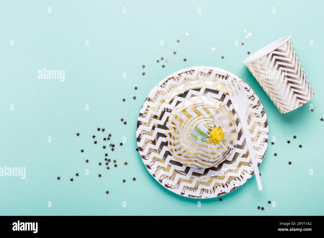 Party Turquoise background with paper gold dishes and confetti Stock ...