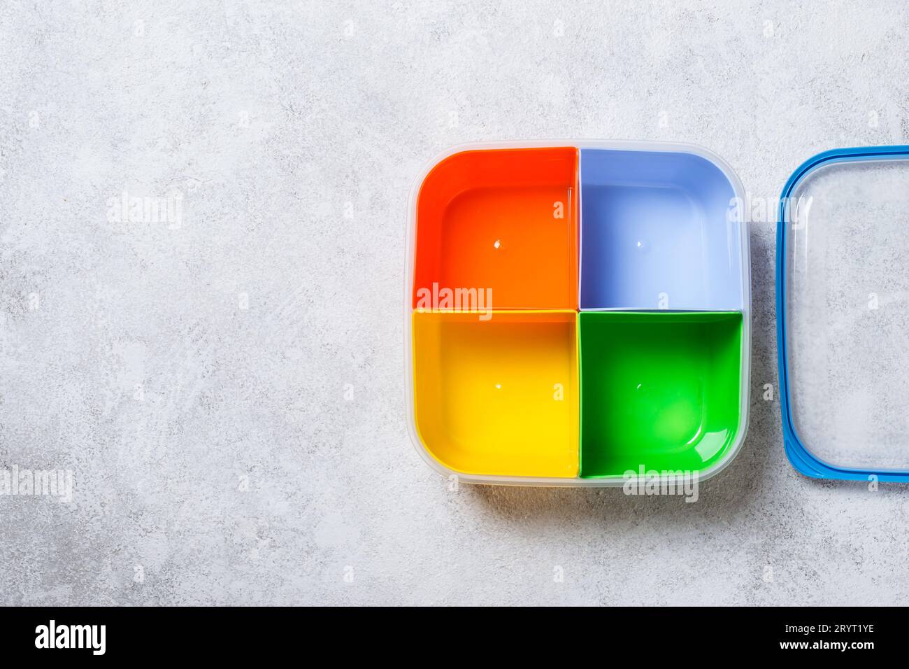 Empty lunch box with four sections for different food Stock Photo - Alamy