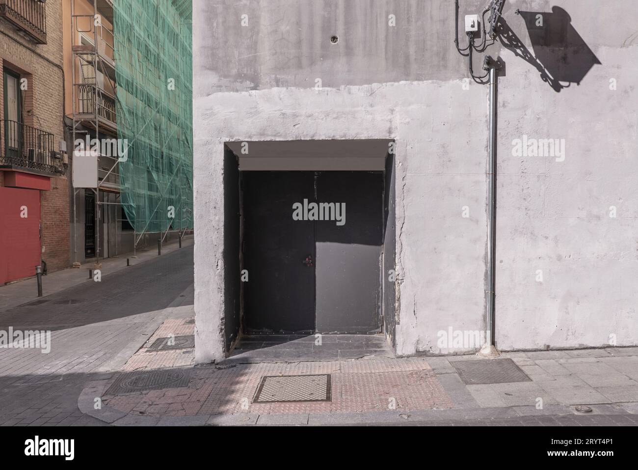 Rear entrance of a nightclub with gray painted metal doors Stock Photo ...