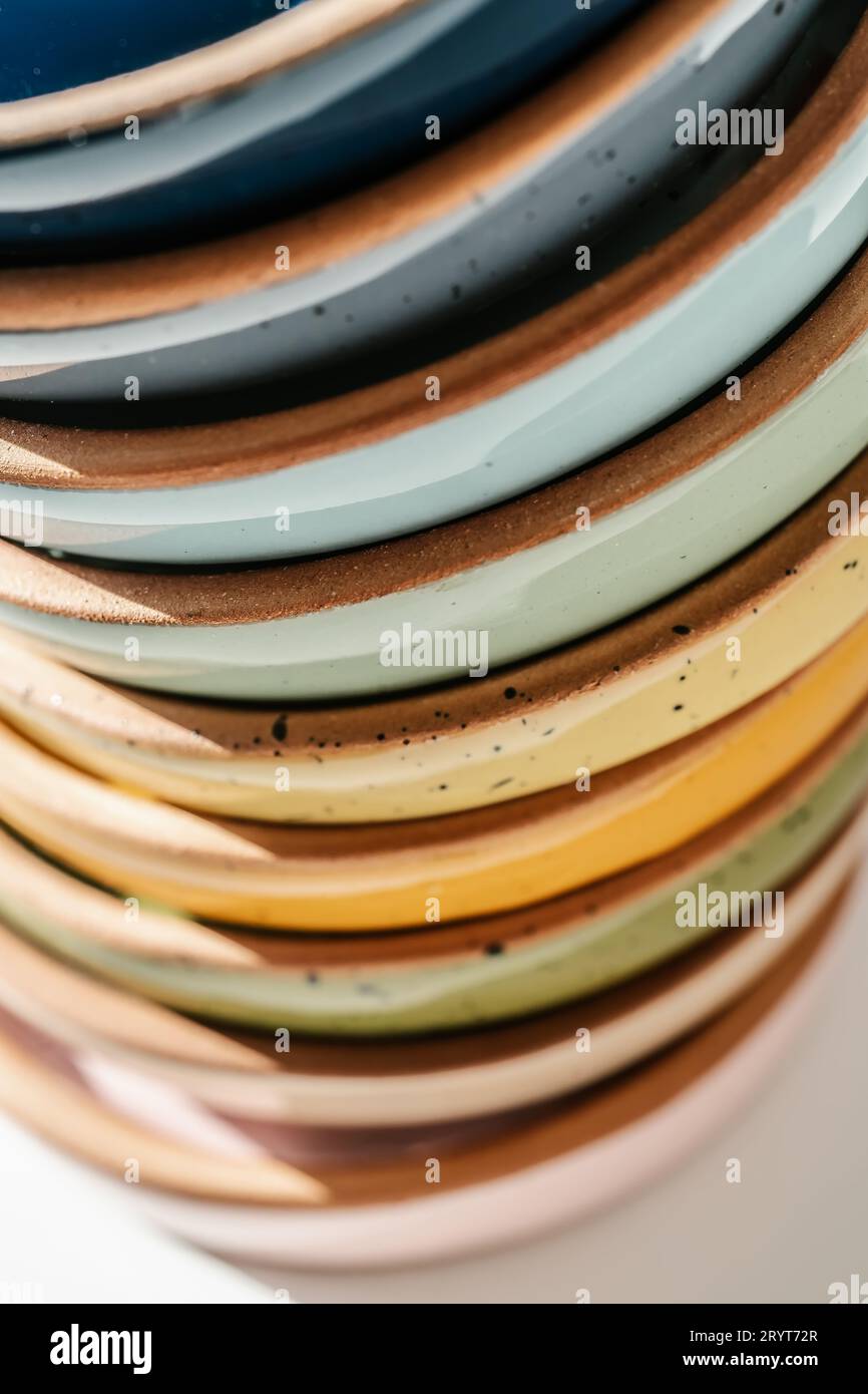 A large stack of ceramic cups in pastel colors Stock Photo - Alamy