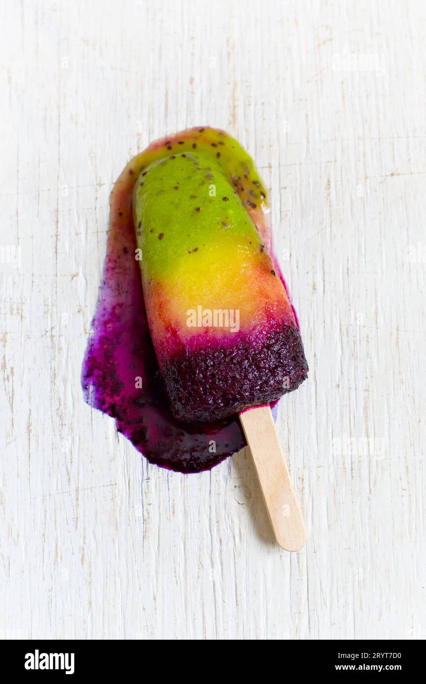 Melted Layers fruit ice lolly on a white background, natural sum Stock ...