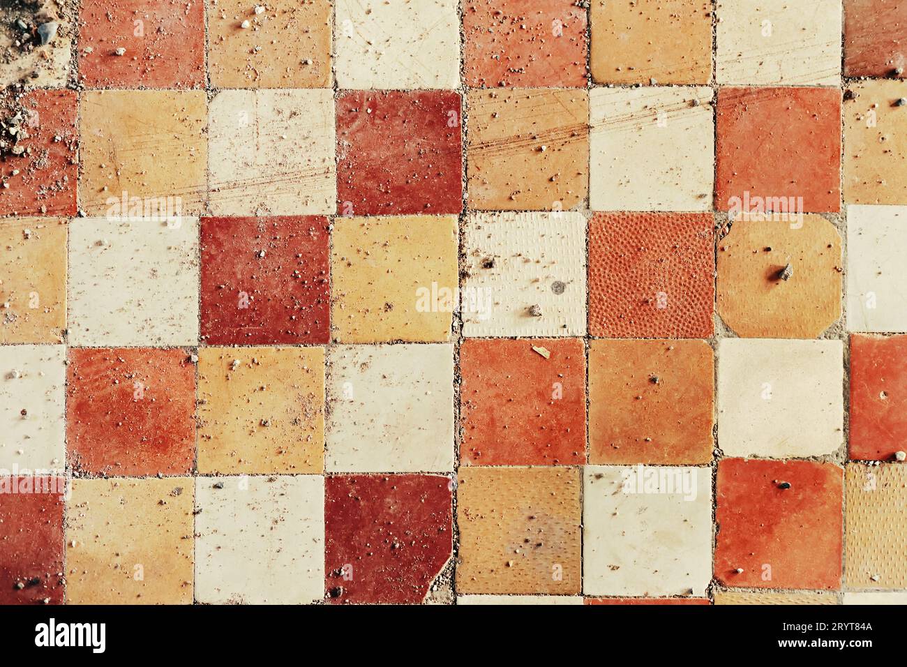 Old and dirty crumbling ceramic tile floor. Grunge interior background ...