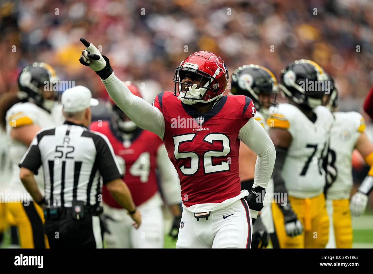 Houston Texans defensive end Jonathan Greenard (52) reacts after making ...