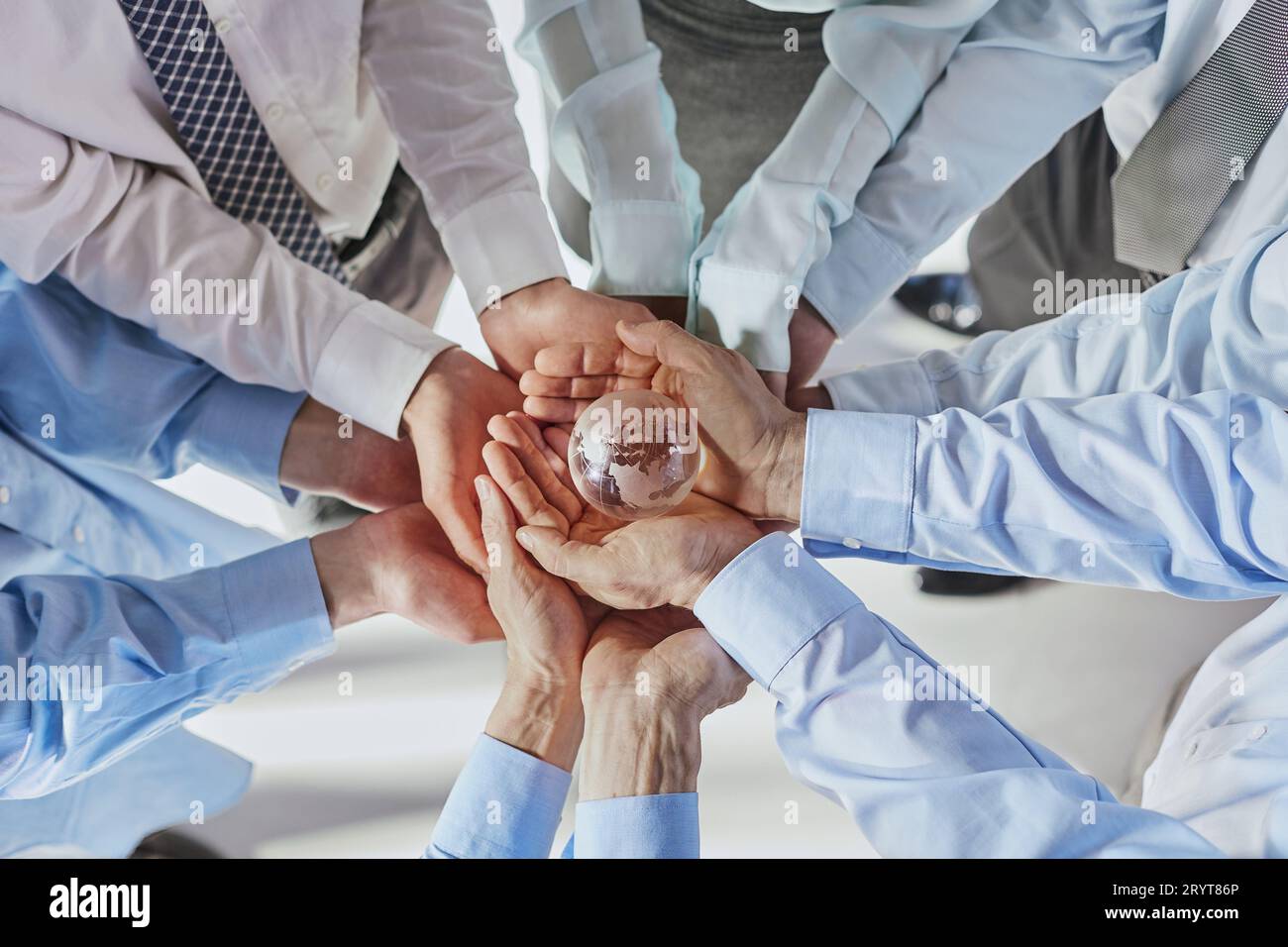 Many different hands are holding planet Earth Stock Photo - Alamy