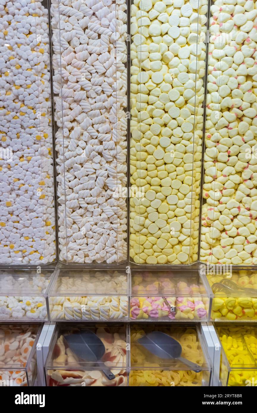 showcase of candy shop, transparent container with sweets, candy and ...