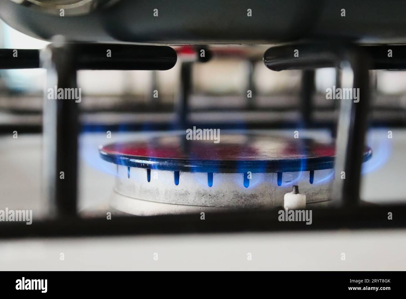 Natural gas stove top heating a cooking pan with blue flames Stock ...