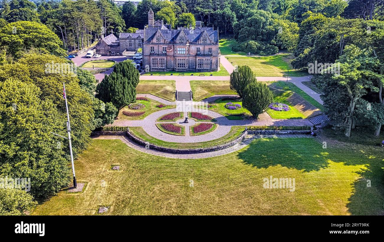 An aerial view of the historic Bangor Castle surrounded by lush green ...