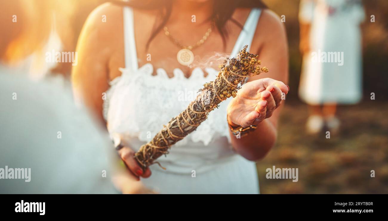 incense in a woman hand, ceremony space Stock Photo - Alamy