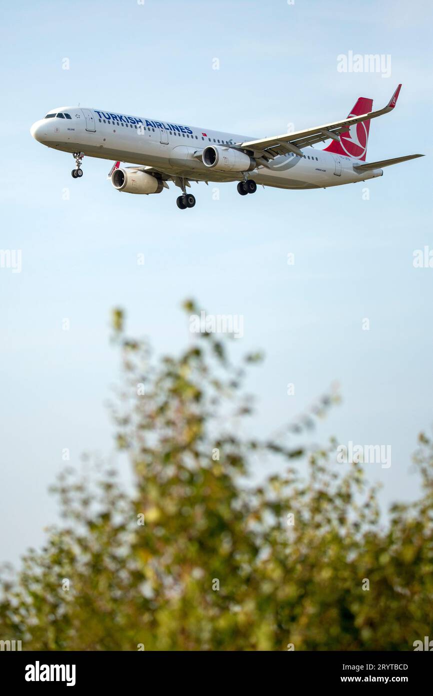 A Turkish Airlines airplane in the sky, soaring through the clouds ...