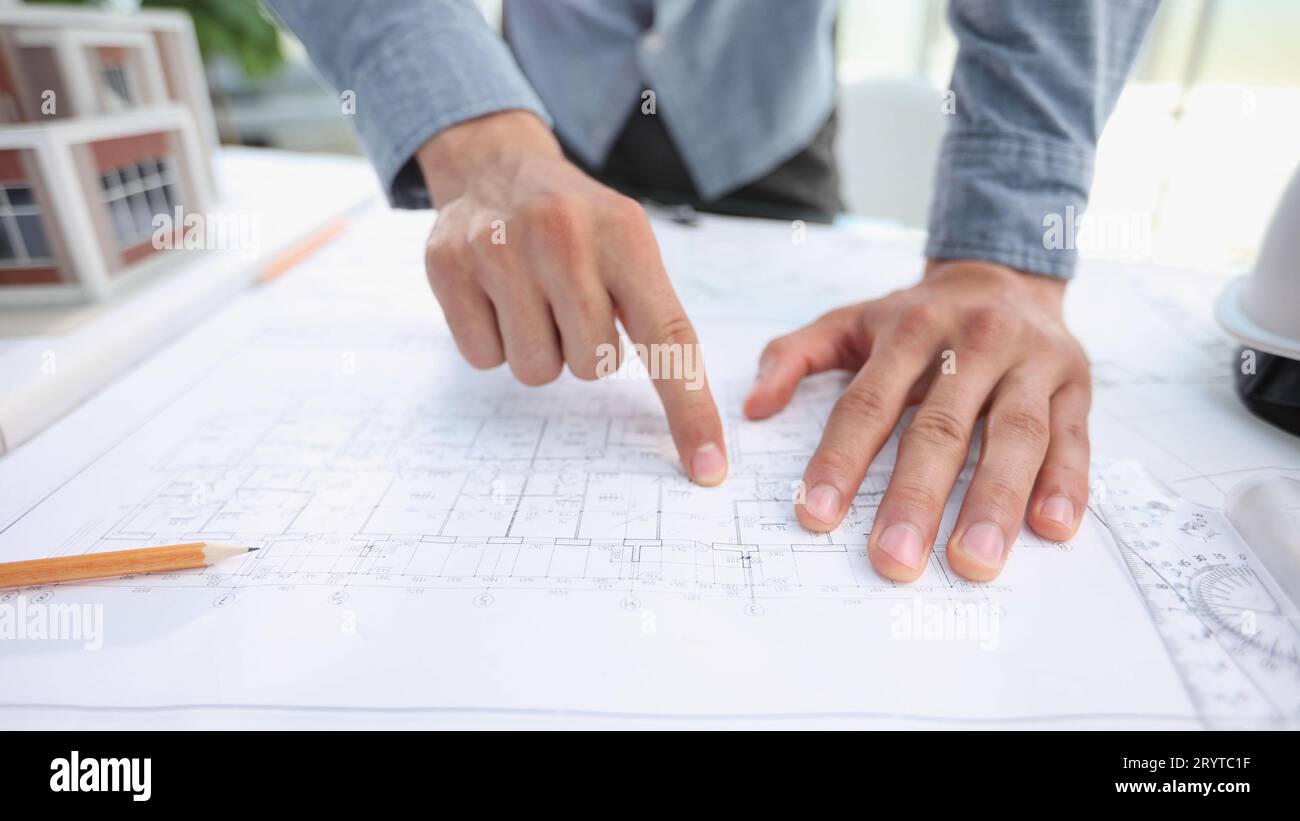 designer drawing graphic design of building project, improvement at ...