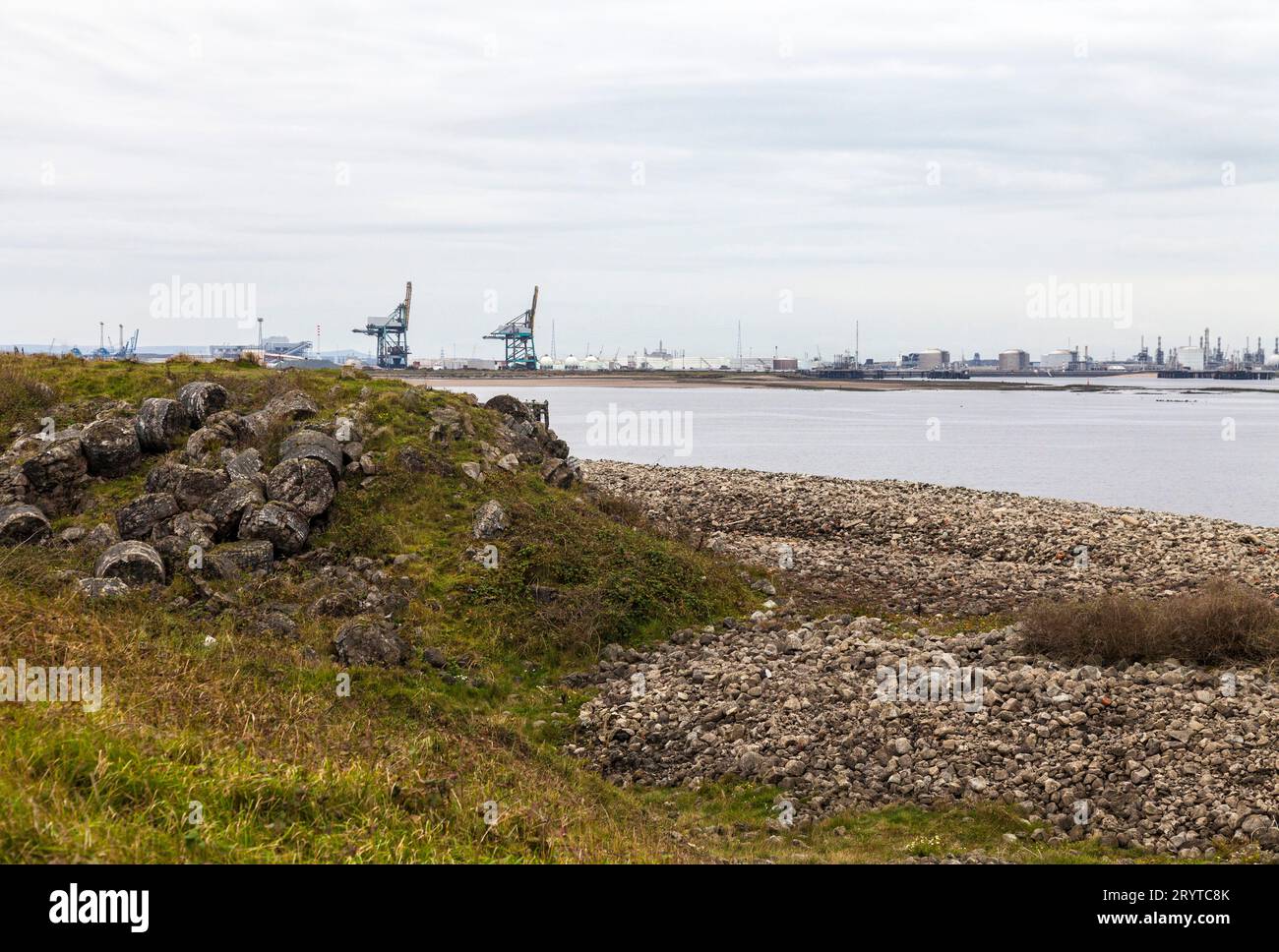 A view of Teesport from South Gare,Redcar,England, UK with its rocky ...