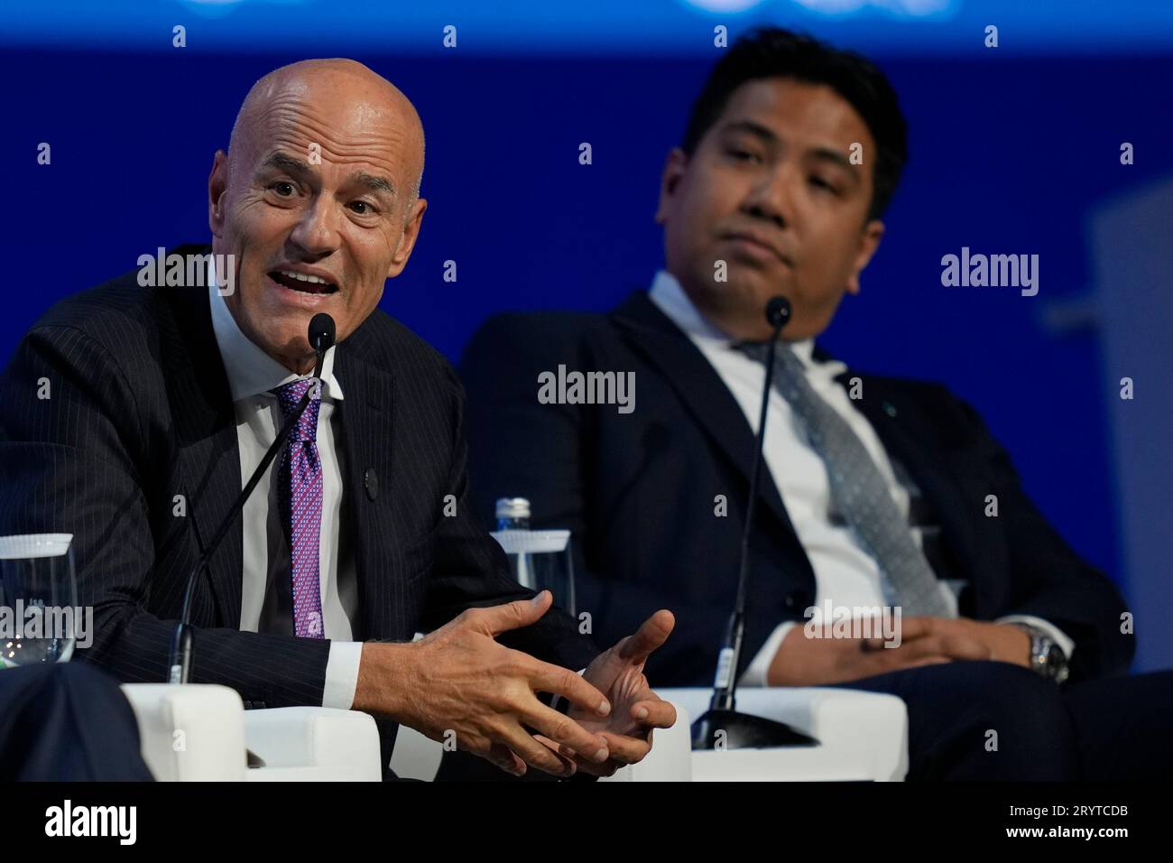 Claudio Descalzi, Eni's CEO, left, talks next to Tengku Muhammad Taufik ...
